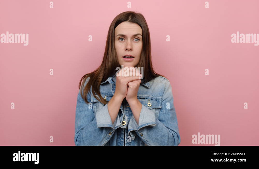 Scared woman look camera covering hiding face with hands peep through ...