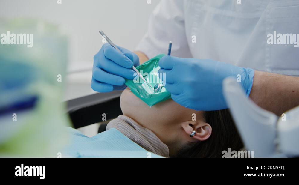 Filling the root canal of a patient's tooth Stock Video Footage - Alamy