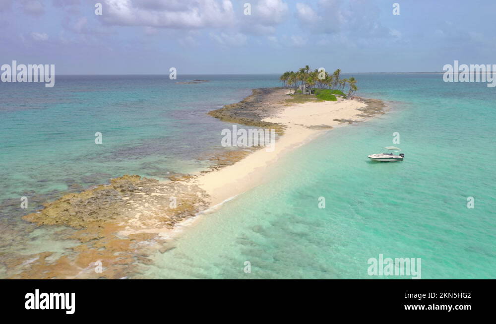 Nassau, Bahamas circa-2021: Flying by small tropical island and boat ...