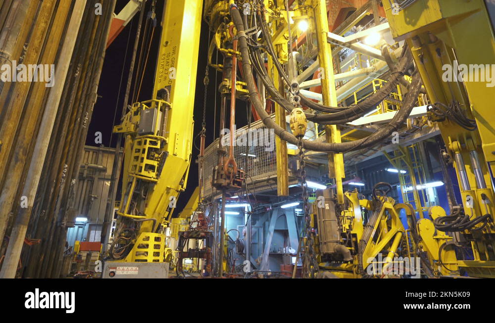 Drilling platform. Rig floor. Rotary table of rig. Top drive goes down ...