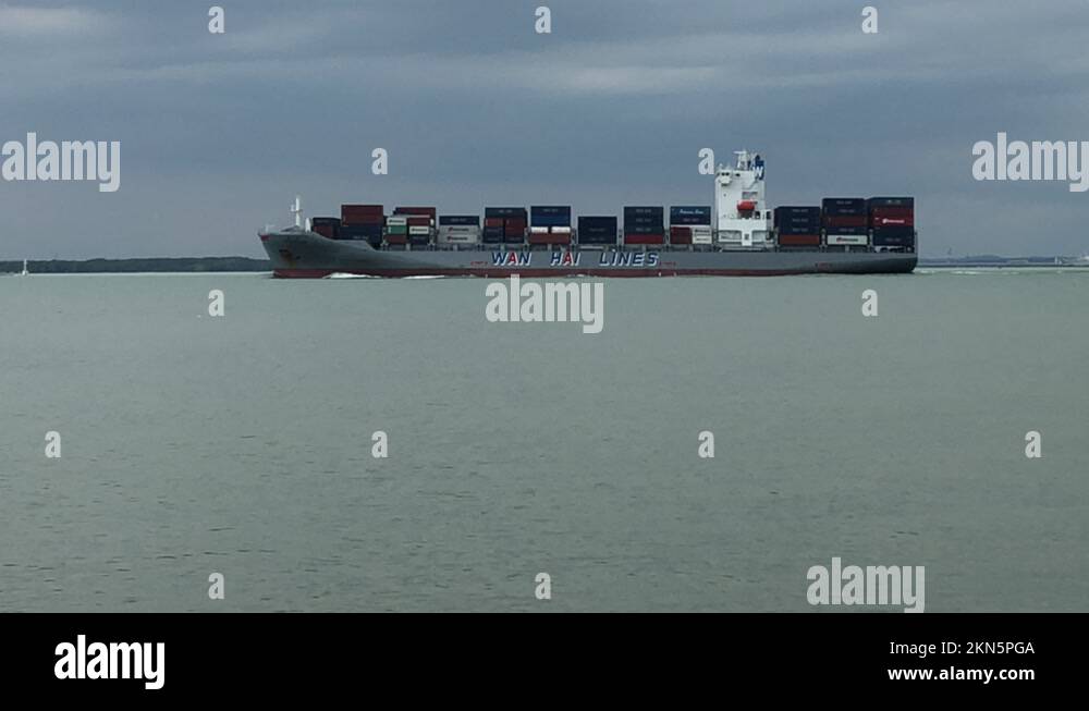 Singapore: A container ship sails by the shore at Changi Beach Park, 4K ...