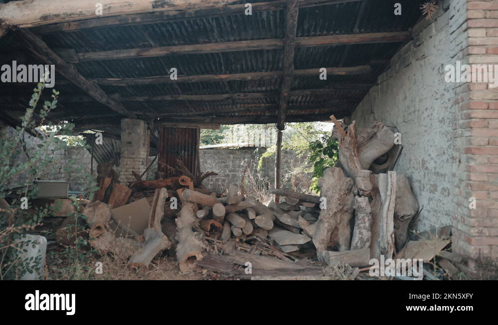Total destruction of village house rock walls and construction frame ...