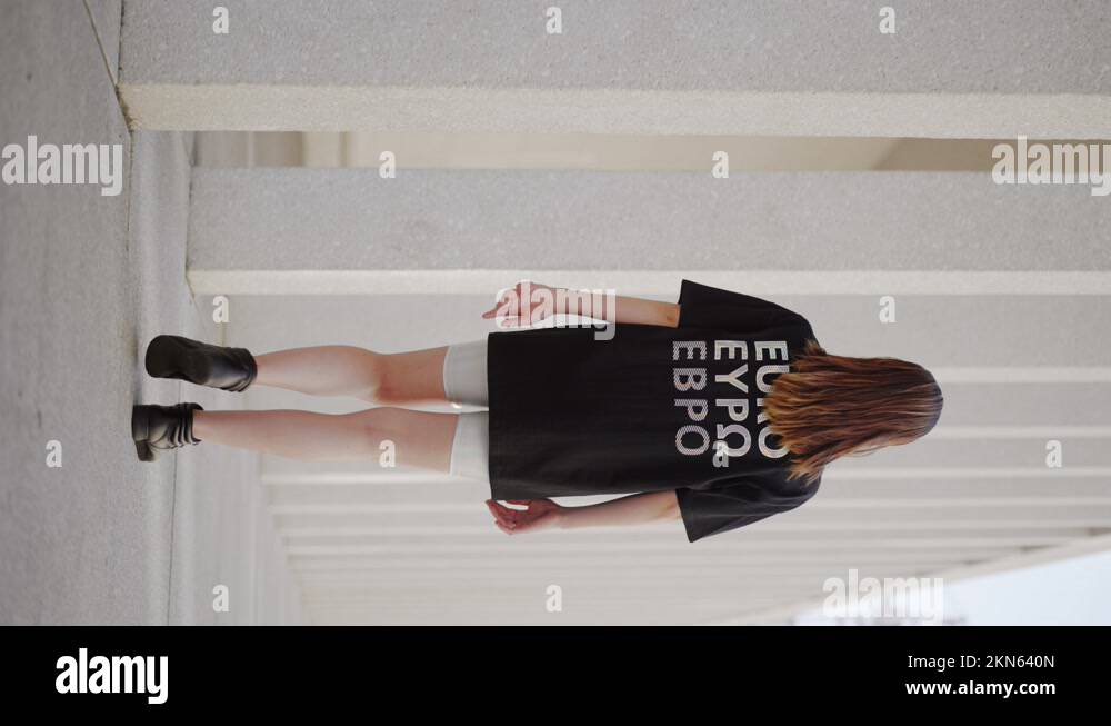 Vertical: rear view of woman's fast fashion model shoot Stock Video ...