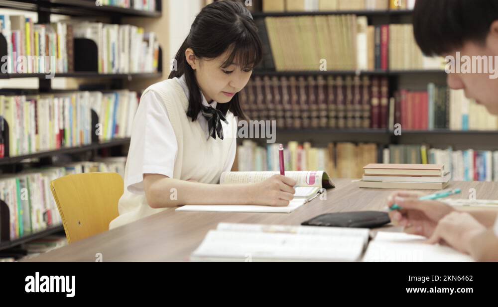Japanese junior-high school students in the library Stock Video Footage ...