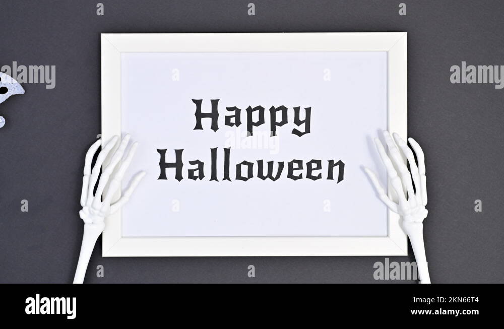 Happy Halloween stop motion with skeleton arms take board and ghost ...