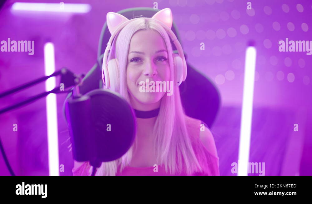 Blonde Gamer Girl wearing cat ear headphones streaming talking to ...