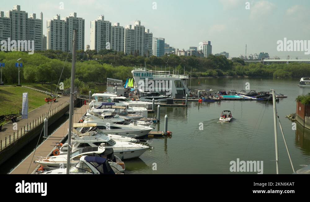 A small motorboat leaving the Seoul Marina Yacht club Yeouido Han River ...