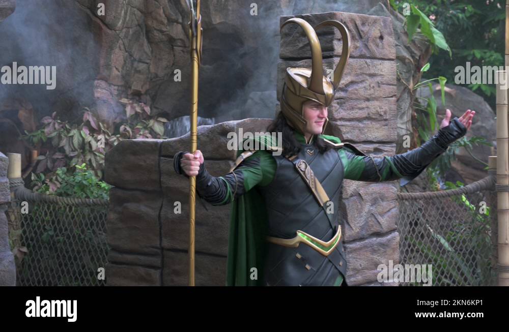 An actor dressed as the Marvel character Loki poses for visitors during ...