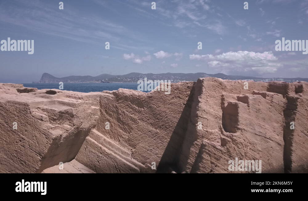 Strange rock formations form natural pool, Ibiza, drone flyover, reveal ...