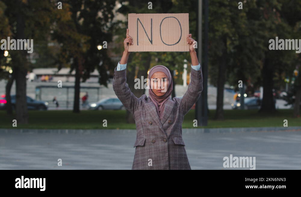 Stop racism concept Arab immigrant Muslim woman in hijab protests ...