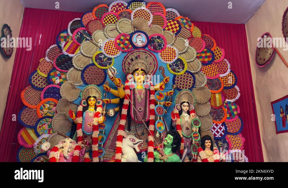 KOLKATA , INDIA -:Hindu Bengali priest putting dress materials on idol ...