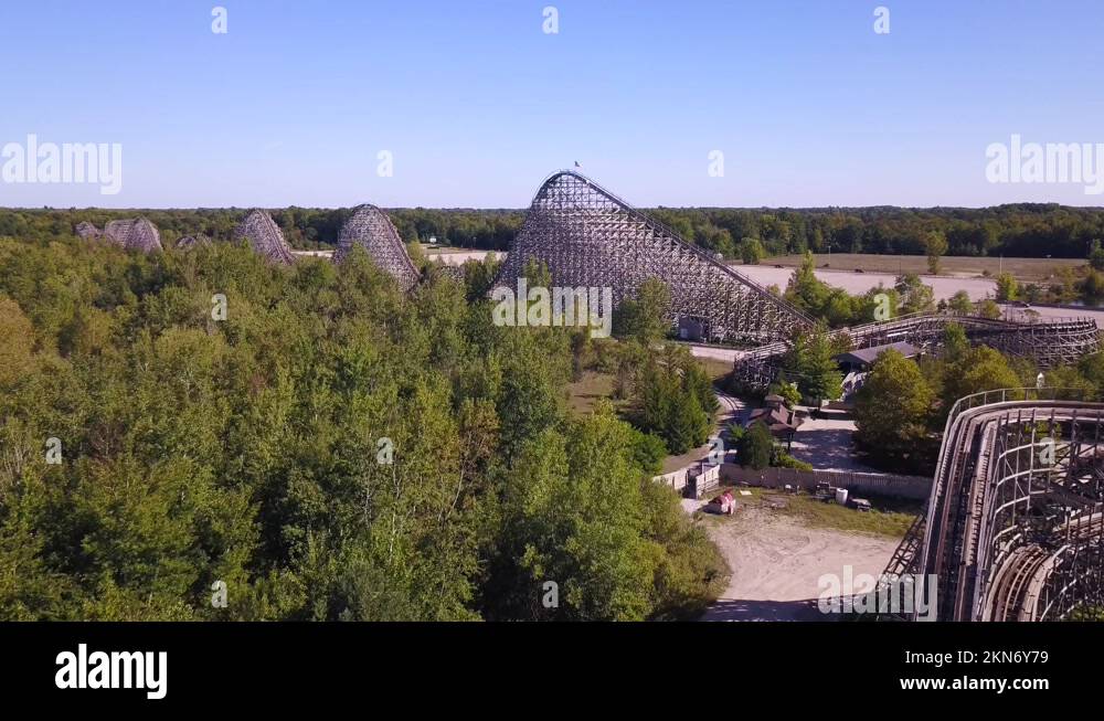 Forward aerial of rollercoasters and forest at Michigan’s Adventure ...