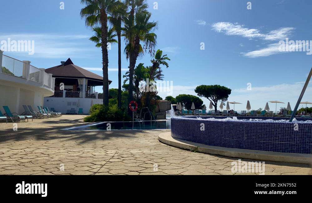 Palm Trees And Bubbling Swimming Pool In A Luxury Resort At Summer ...