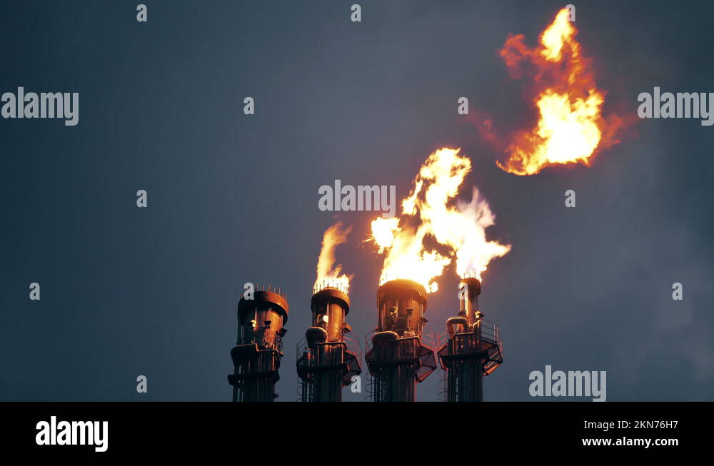 Air pollution concept. Refinery flare stacks with fire caused by gas ...