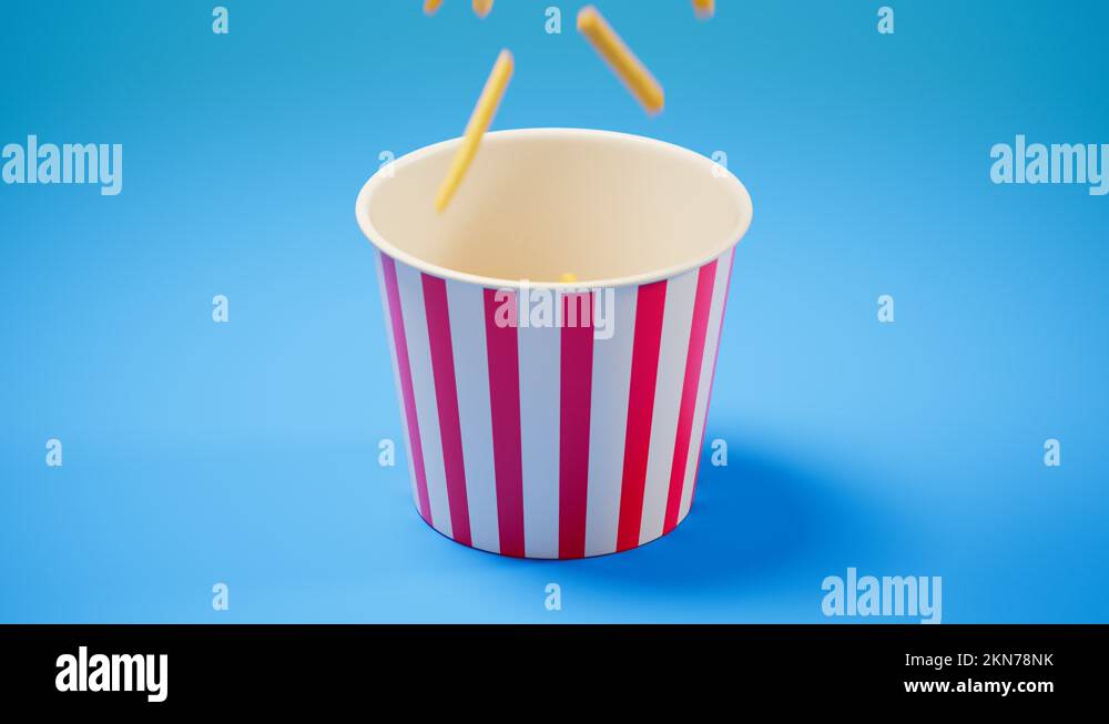 Delicious and crispy fried chicken with fries in a paper bucket. Fast ...