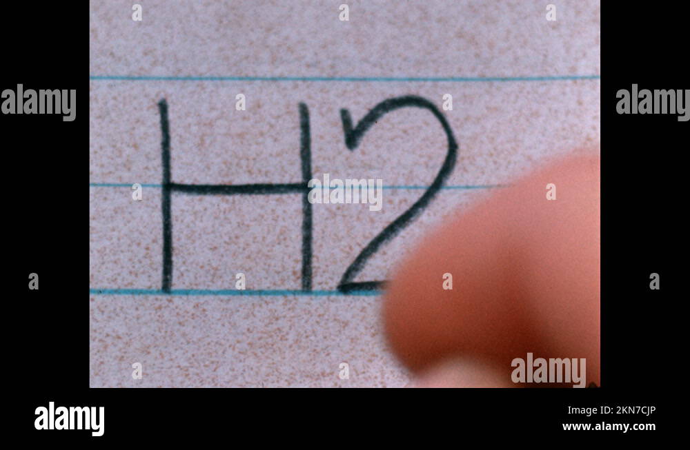 1960s: Numbers on paper. Extreme close up, hand writing word in reverse ...