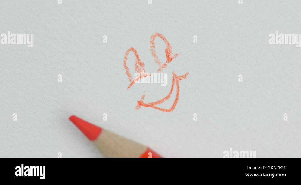 Sharp End Of Orange Colored Pencil With Draw Sketch Of Smiley Face In ...