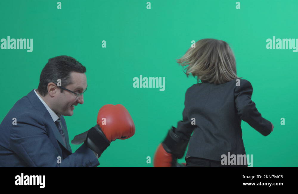 Man and kid box fighting on green screen Stock Video Footage - Alamy