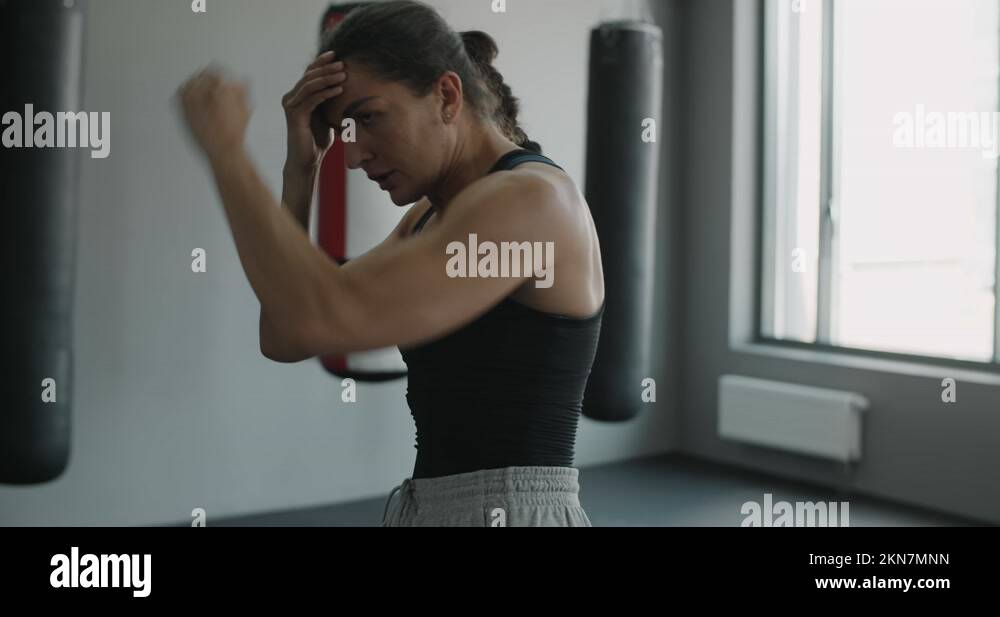 Mixed martial art fighter woman does shadow boxing in the fight club, female Stock Video Footage ...