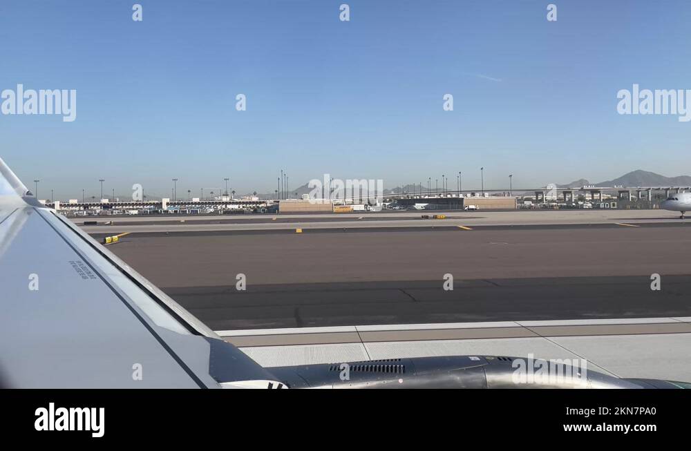Looking out the window of an airplane while it takes off in Phoenix ...