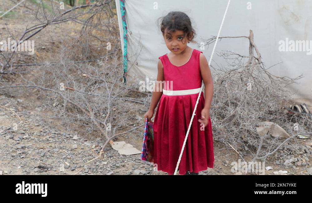 A sad child in a camp for displaced people from the war in Yemen Stock ...