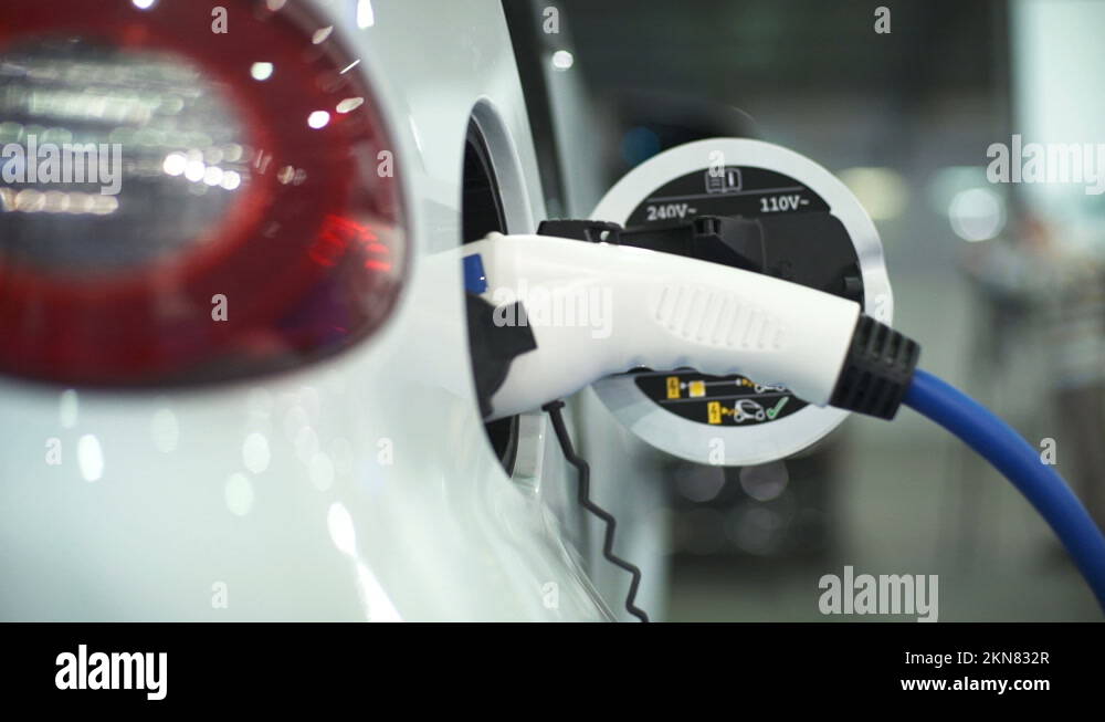 Electric vehicle charging port plugging in EV modern car Stock Video ...