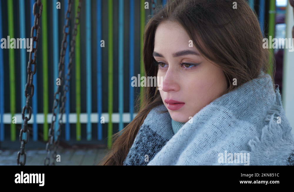 Beautiful girl sitting on swing on metal chains Stock Video Footage - Alamy