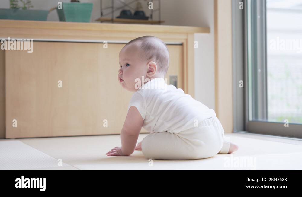 Pretty baby in the room. Child rearing concept Stock Video Footage - Alamy