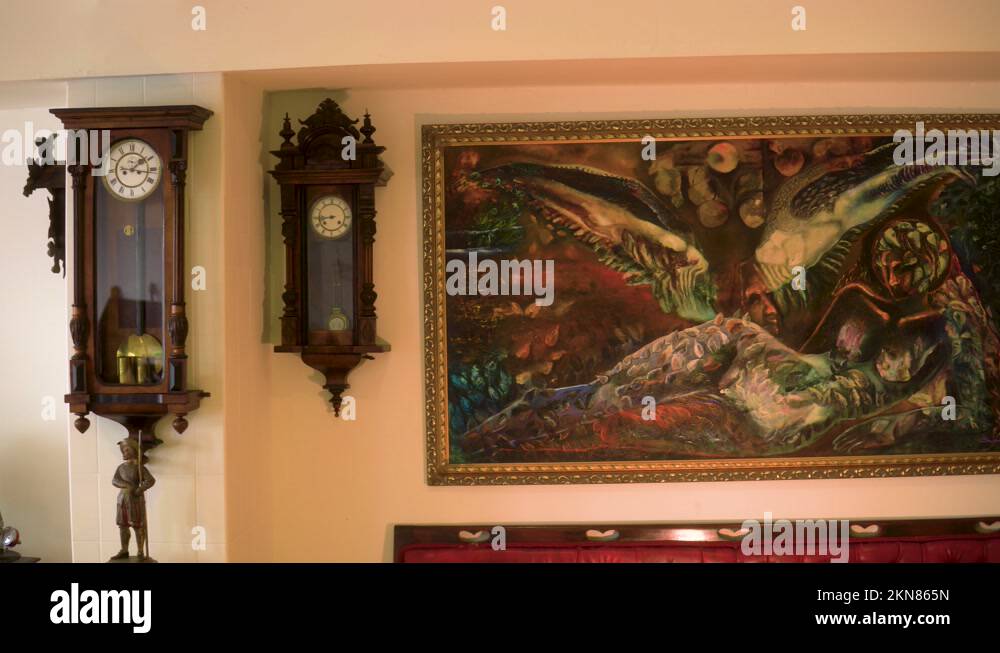 vintage clocks on the wall and scary satanic painting horror scene ...
