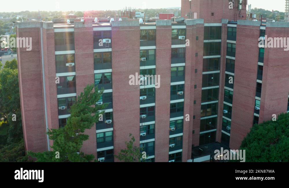 Residential apartment building. Tall brick building. Rising aerial ...