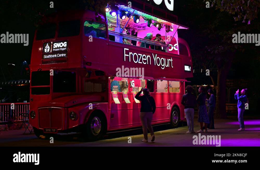 Customers at Double Decker bus frozen yoghurt cafe on Southbank Stock ...