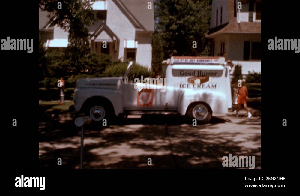 1950s: Man gives children money. The children back away and man walks ...