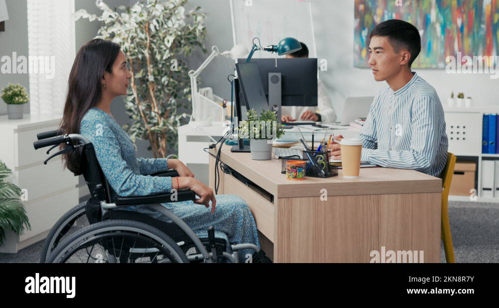Job interview with disabled woman in wheelchair, stern male boss of ...