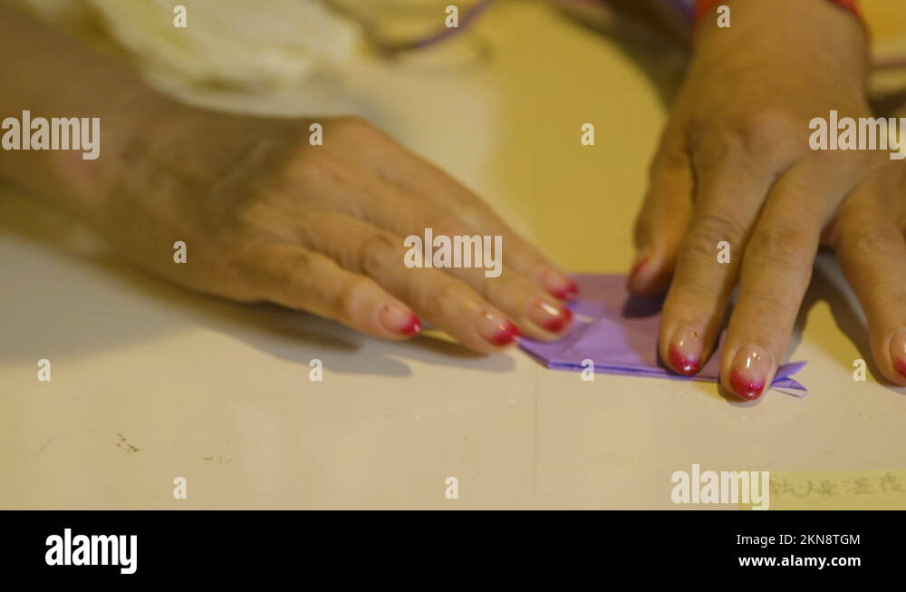 Woman making origami and japanese craftwork at the Tokyo 2020 Olympic ...