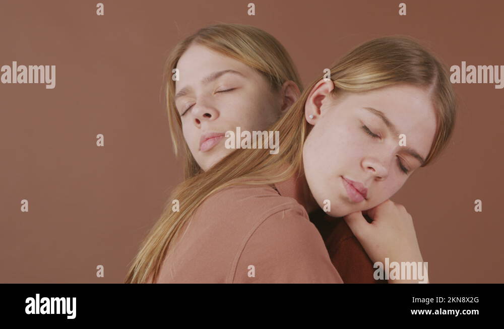 Twins sisters identical siblings Stock Videos & Footage - HD and 4K ...