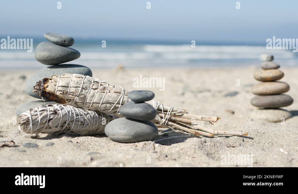 Rock balance on ocean beach, stones stack by sea water waves. Pyramid ...
