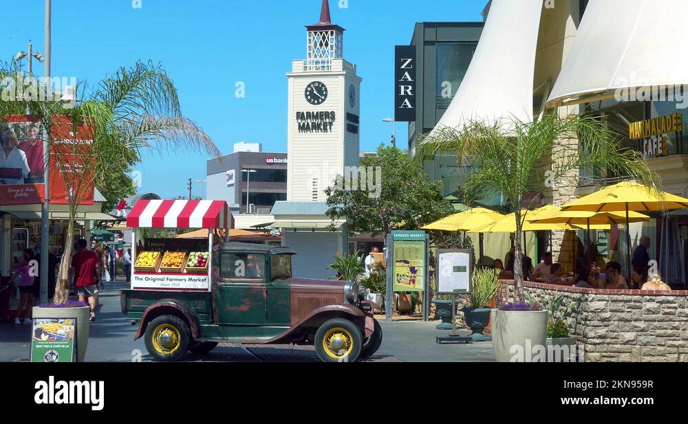 People walking at famous Farmers Market landmark in Los Angeles ...