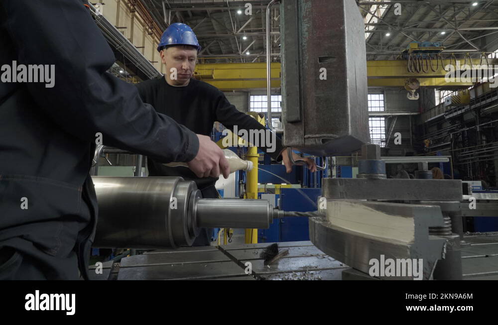 Metal Manufacturing Factory Workers Checking Drill Machine Processing ...