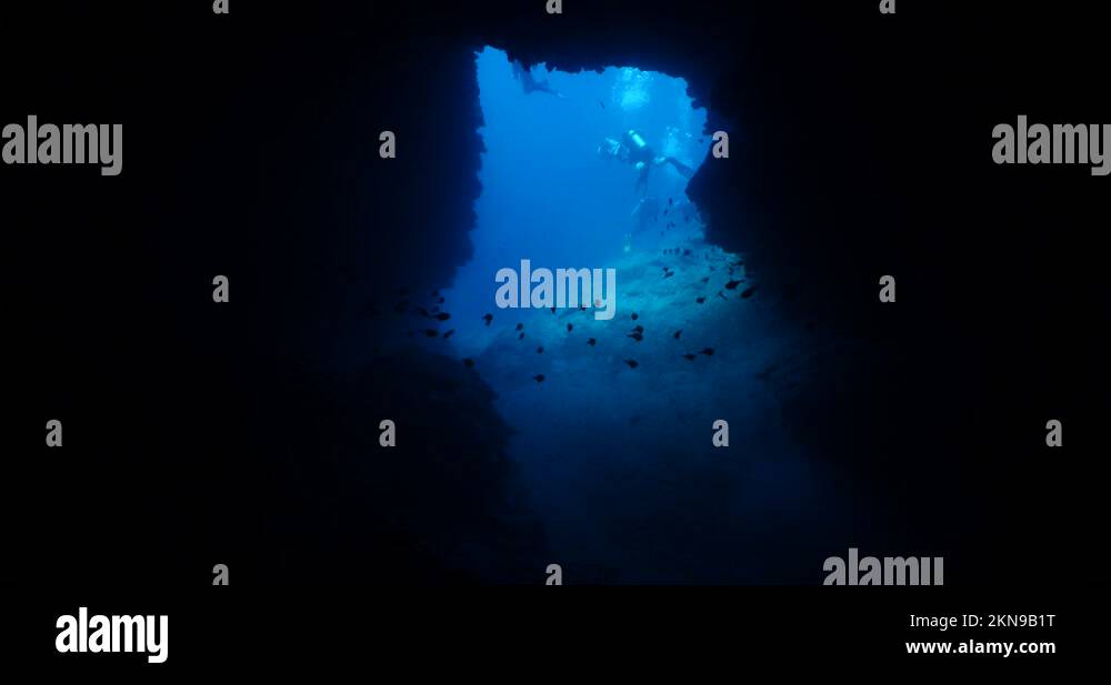 cave diving underwater exploring ocean scenery sun beams and rays ...