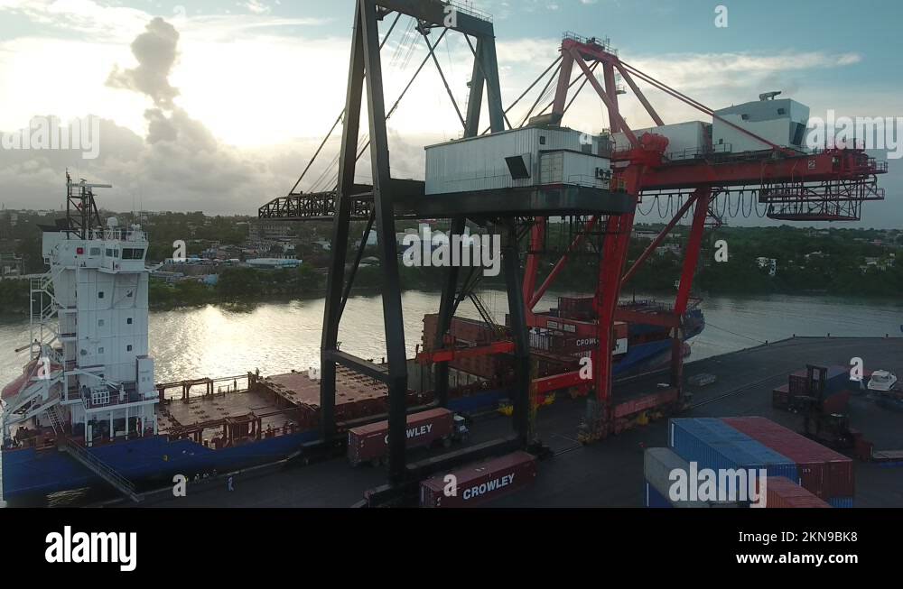 Container stacking crane at work in Haina port, Dominican Republic ...