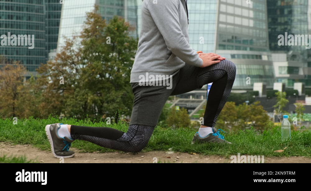 Muscular Shirtless Man Covered in Sweat Does Push-ups. Athletic , City ...