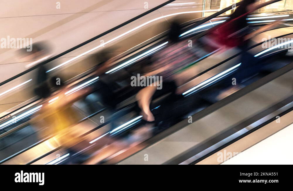 People crowd movement conceptual video background. Escalator in office ...
