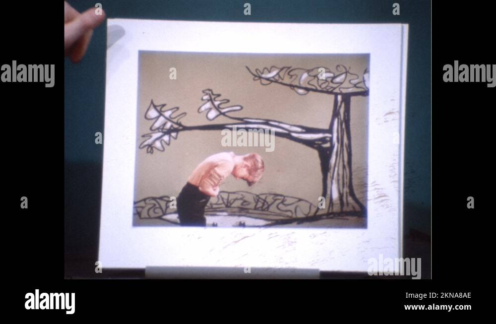 1960s: Person displays two pictures. Person pulls picture out of box ...