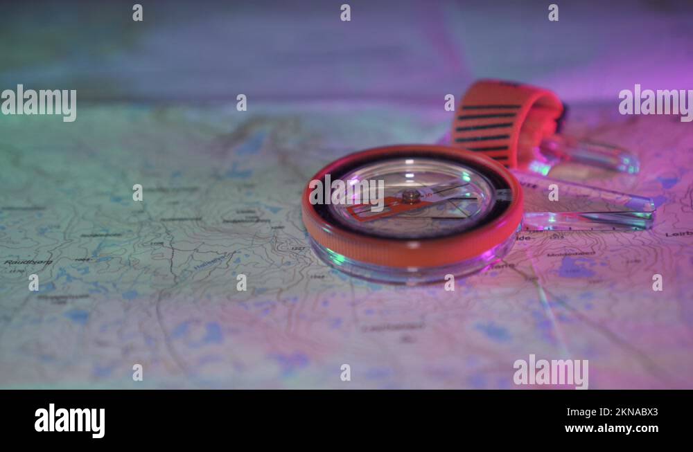 Thumb Compass For Orienteering Racer Lying On Geographical Map With ...