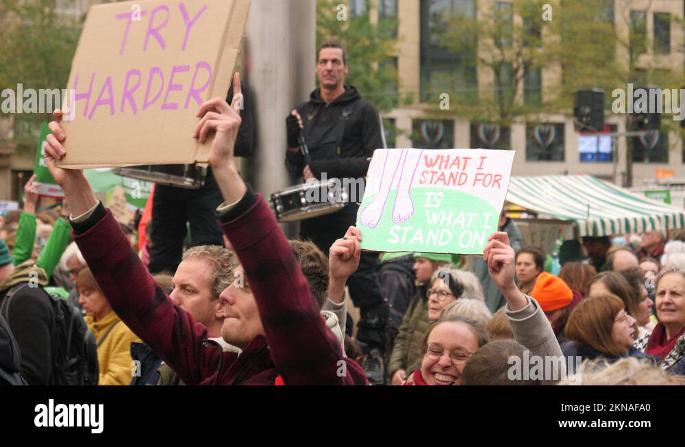 Protestor holding sign Try Harder or Die Harder at Climate rally ...