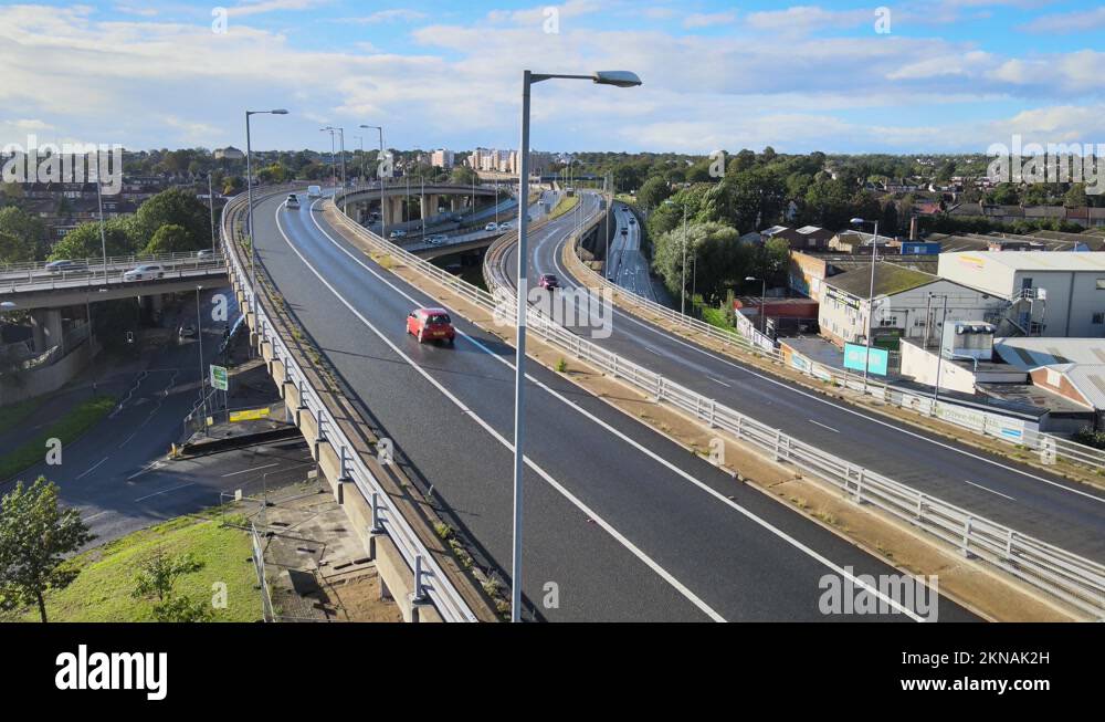 Cars driving on highway bridge in urban neighbourhood Stock Video ...
