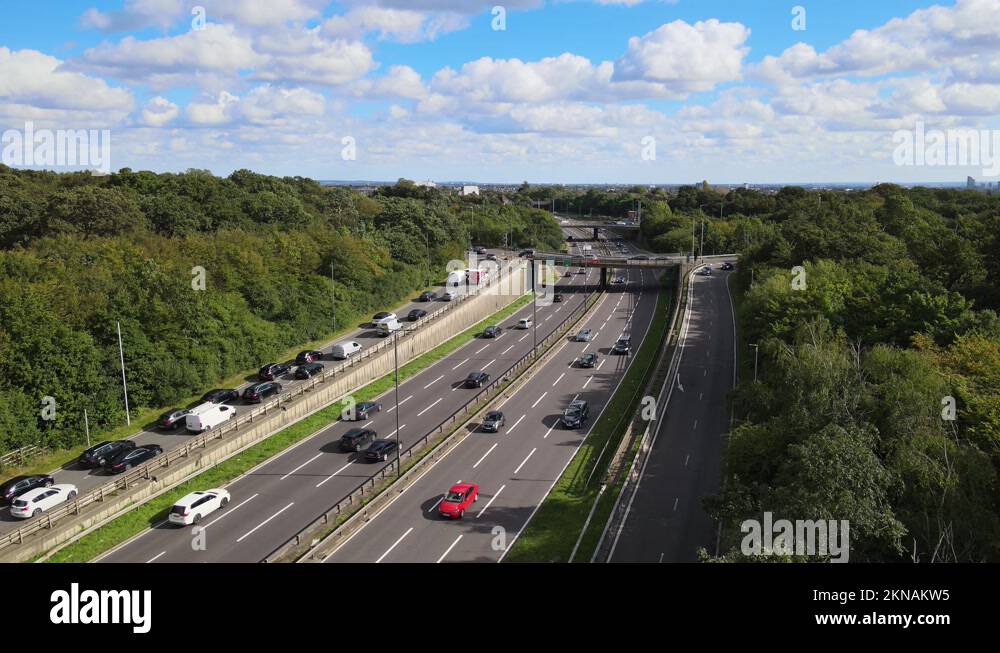 Bridge across highway, slowly moving queue of cars on exit ramp Stock ...