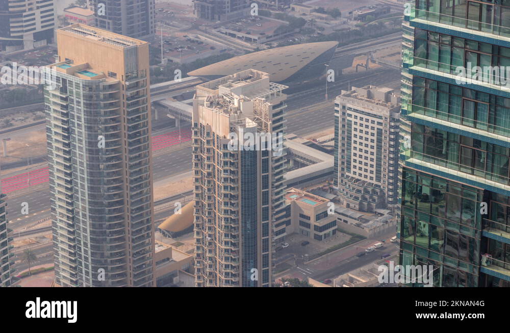 Dubai marina towers with traffic on Sheikh Zayed road near metro ...