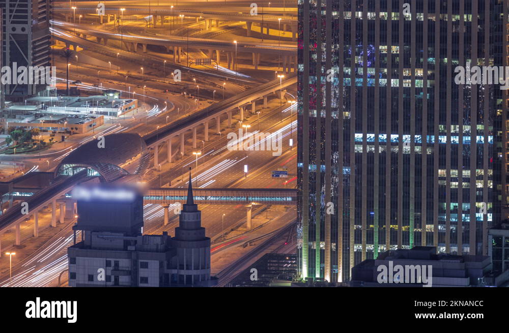 Dubai marina towers with traffic on Sheikh Zayed road near metro ...