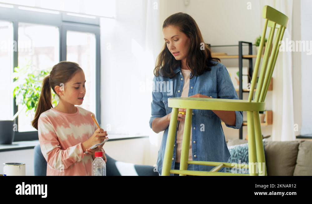 mother and daughter with ruler measuring old chair Stock Video Footage ...